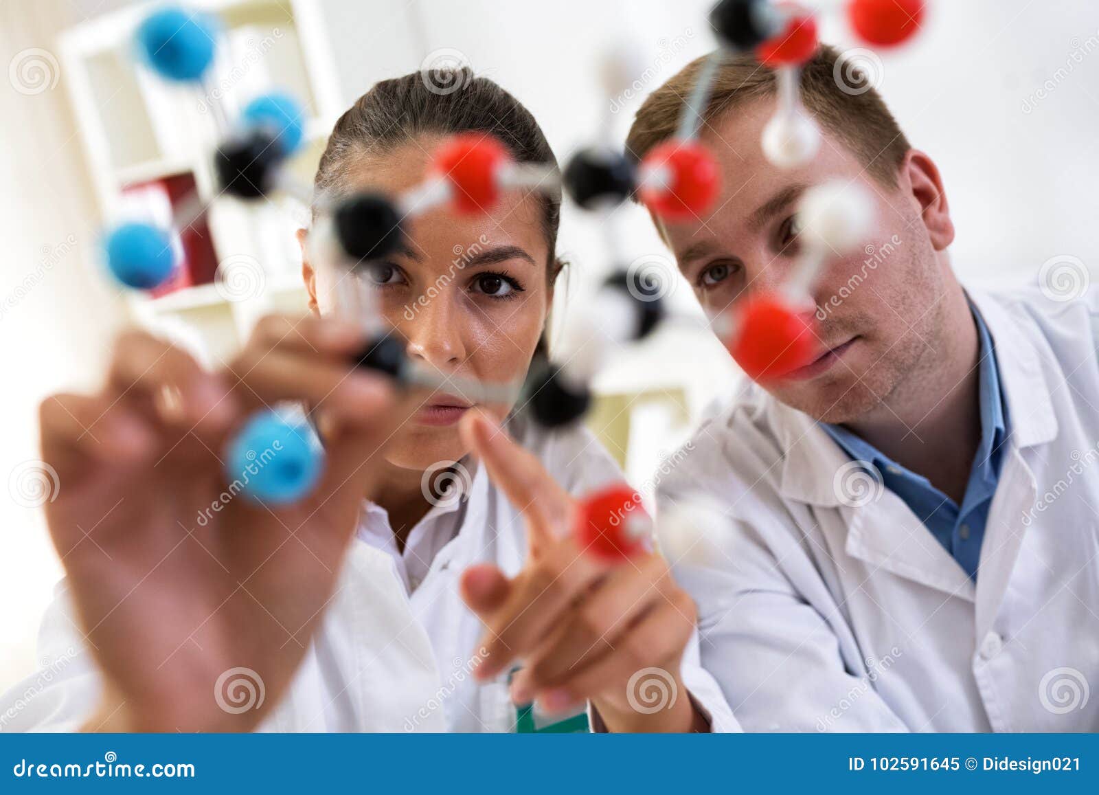 Two Students of Chemistry Looking at Molecular Model and Making Stock ...