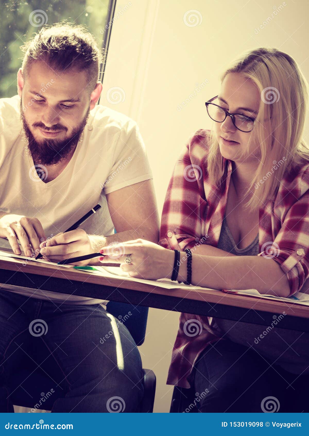 Two students in class stock photo. Image of learning - 153019098