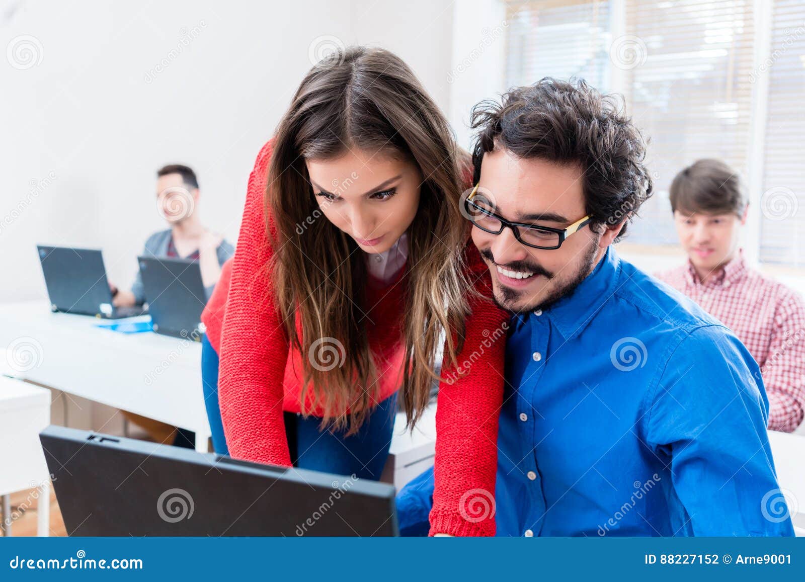 Two Students Discussing Their Work in College Stock Photo - Image of ...