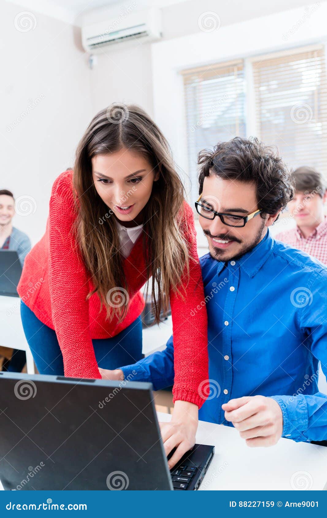 Two Students Discussing Their Work in College Stock Image - Image of ...