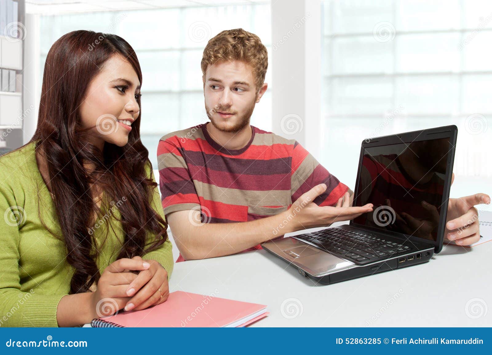 Two Students Discussion about Something on a Laptop Stock Image - Image ...