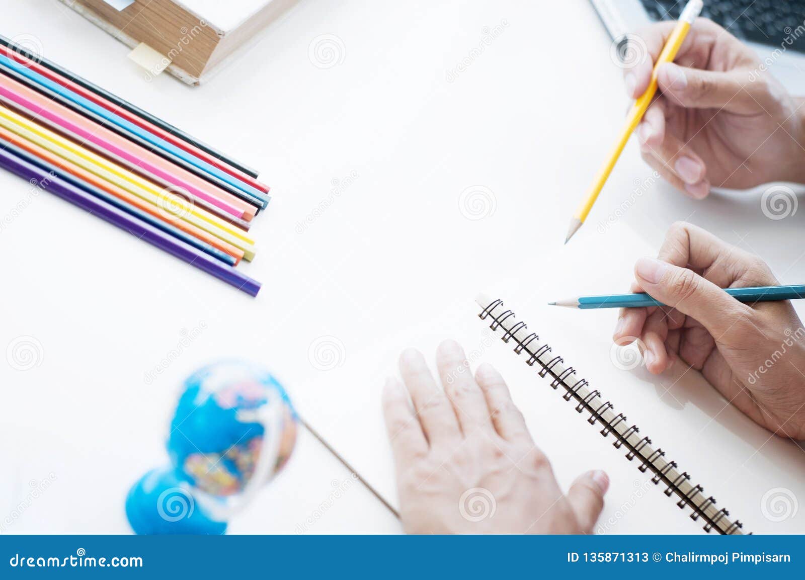Two Students Doing Homework Together and Helping Each Other Sitting in ...