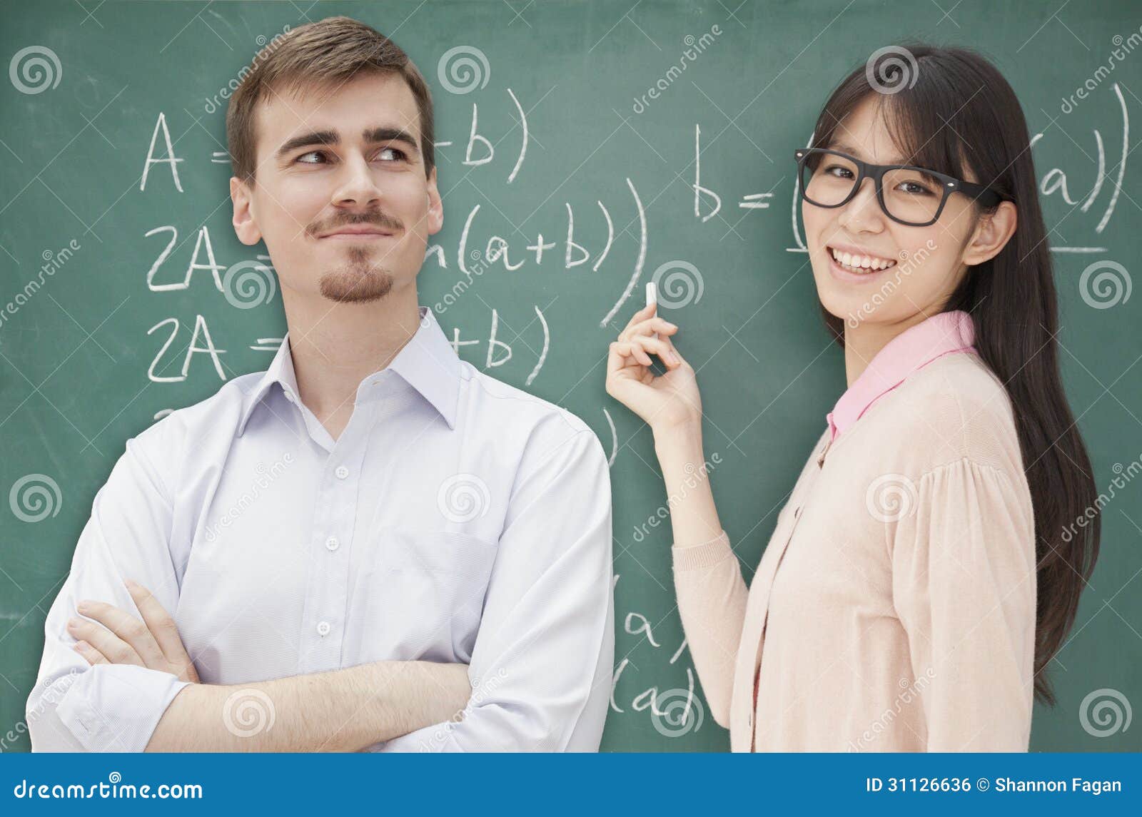 Two Students Doing Math Formula on the Chalkboard, Beijing Stock Photo ...