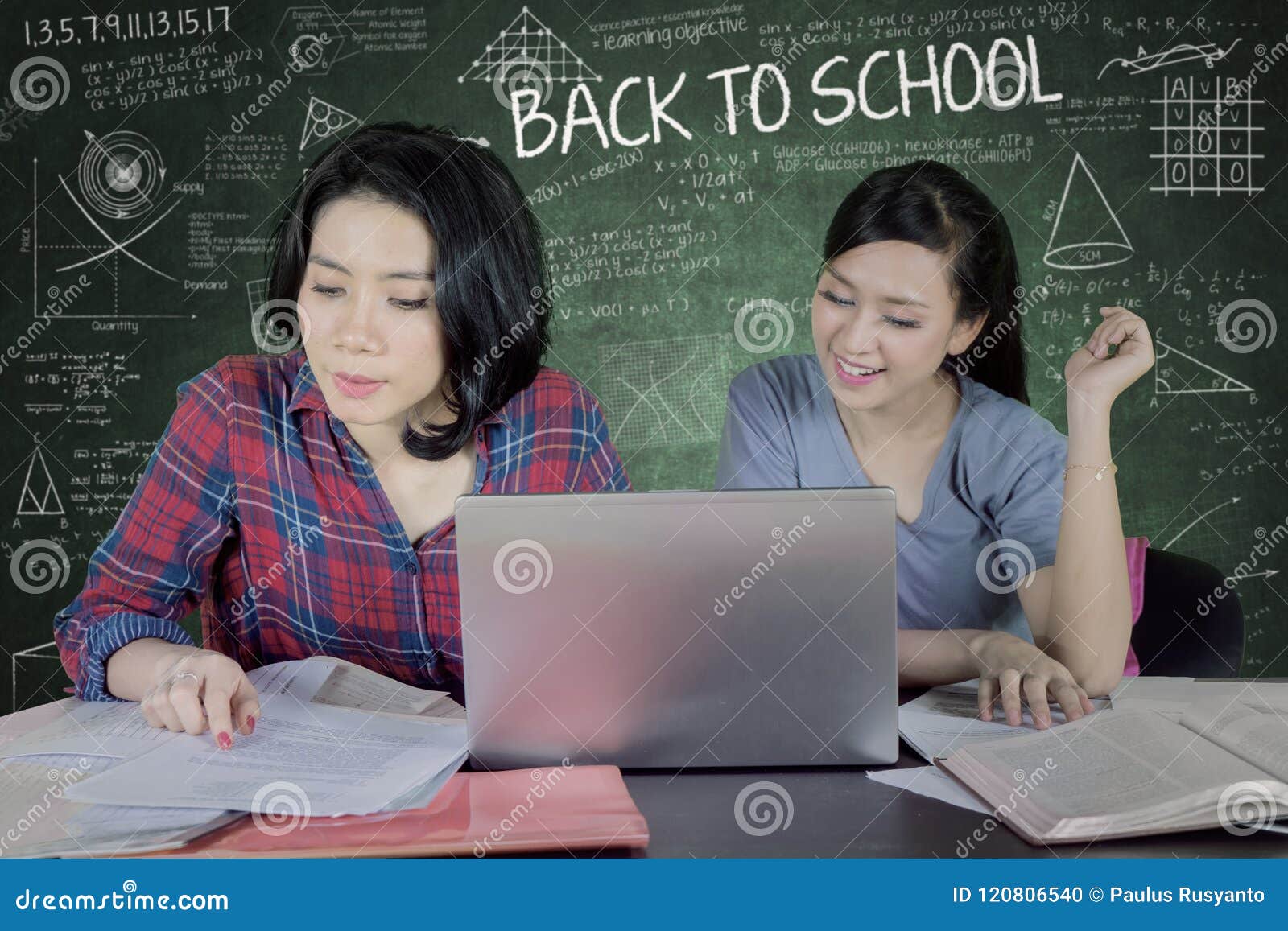 Two Students Doing Schoolwork in the Classroom Stock Photo - Image of ...