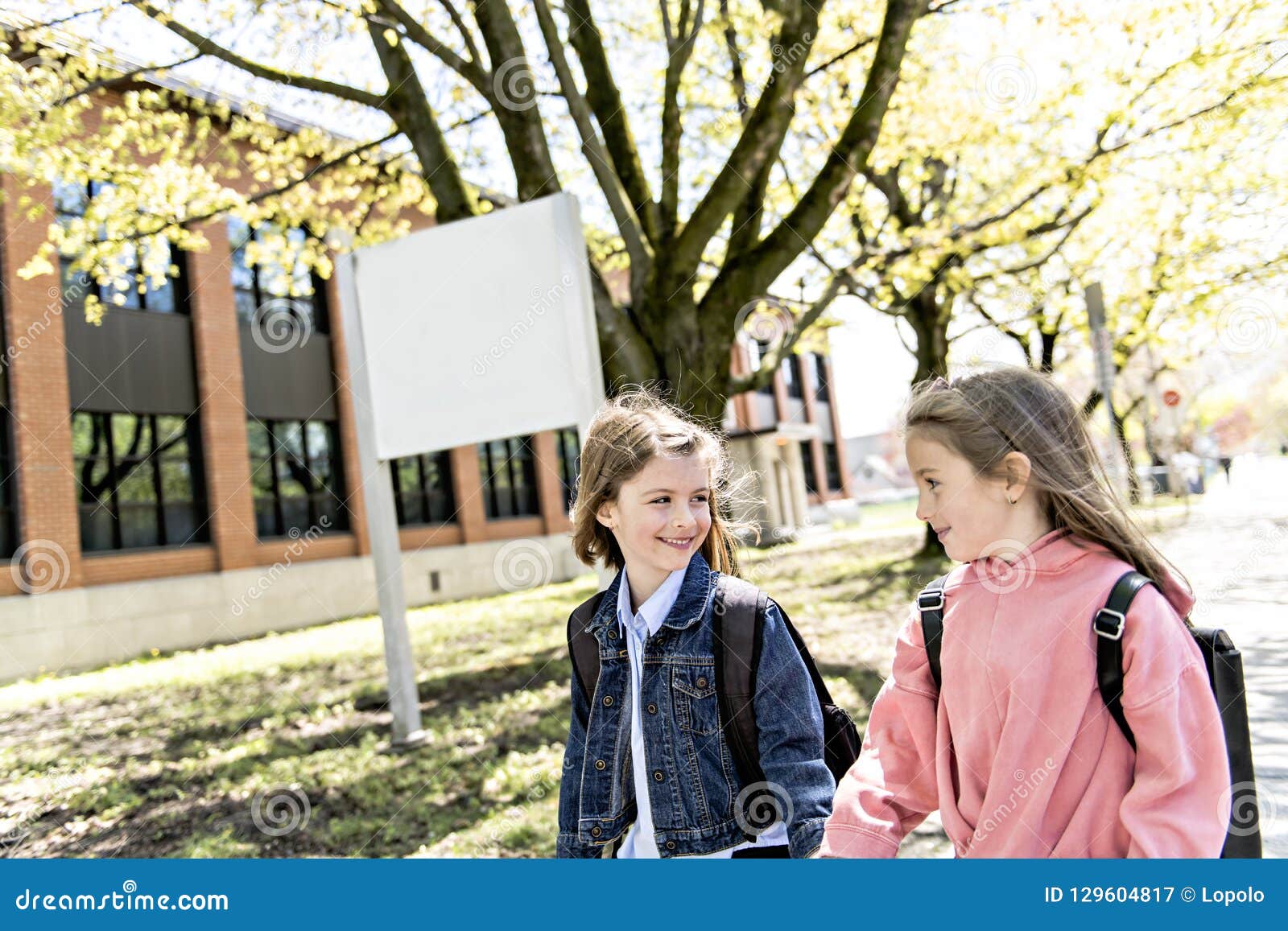 Two Students Outside at School Standing Together Stock Image - Image of ...