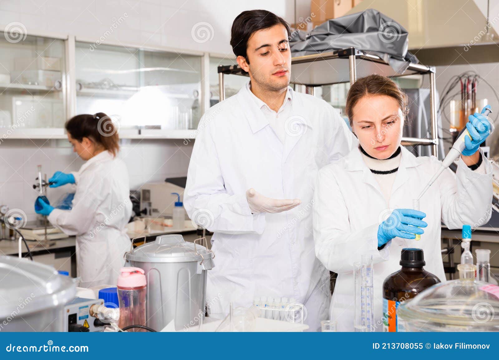 Two Students Performing Experiments in University Laboratory, Using ...