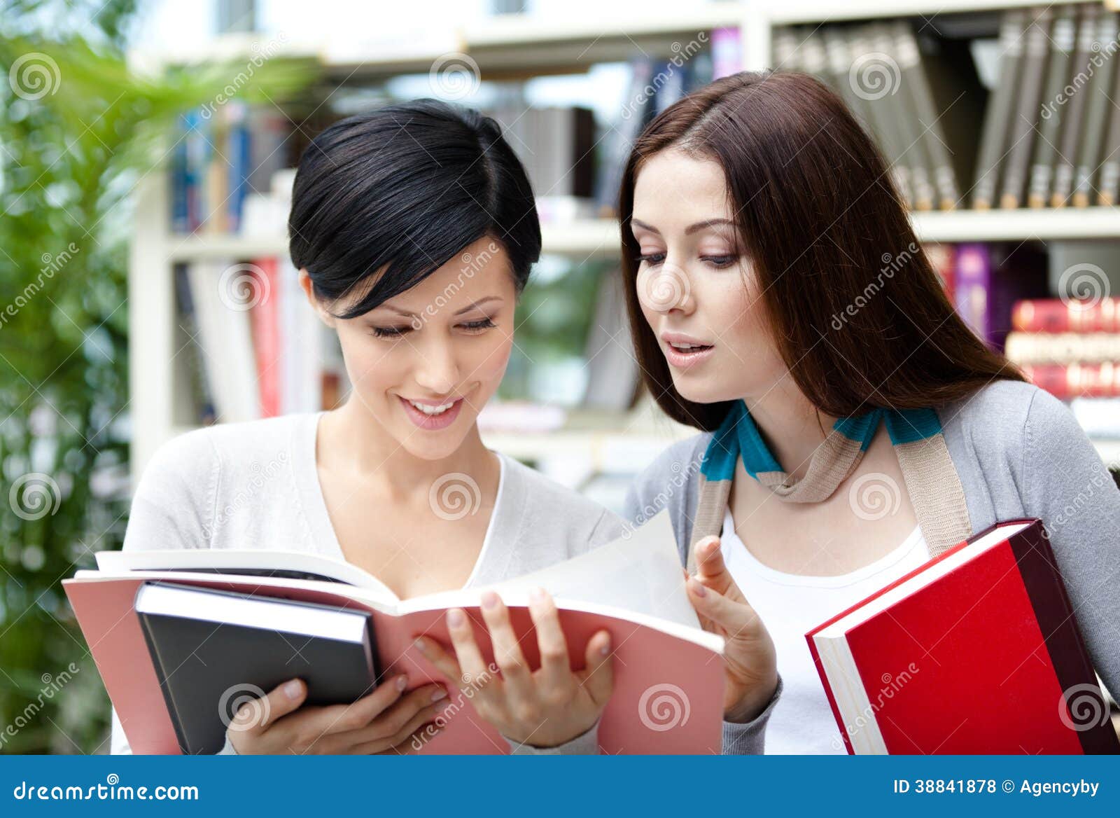 Two Students Read Books at the Library Stock Photo - Image of format ...