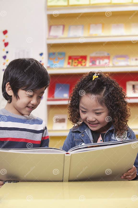 Two Students Reading stock photo. Image of happy, holding - 33372744