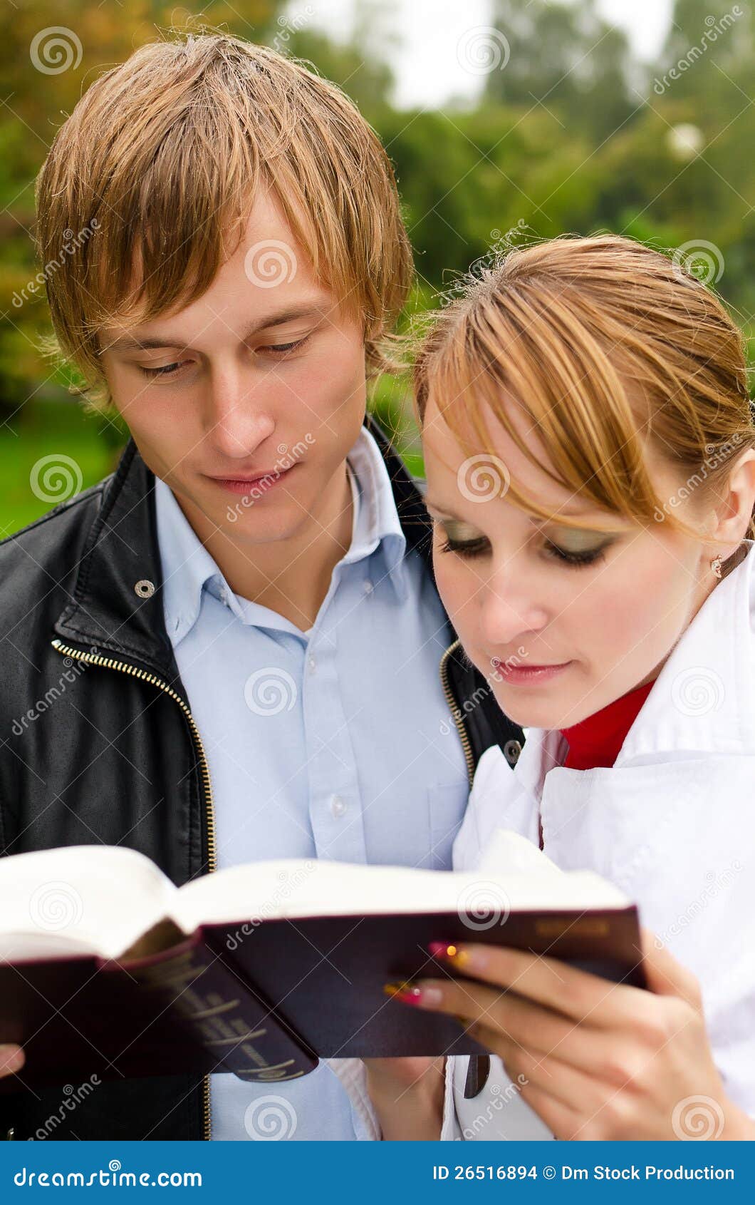 Two Students Reading a Book Stock Photo - Image of outdoor, showing ...