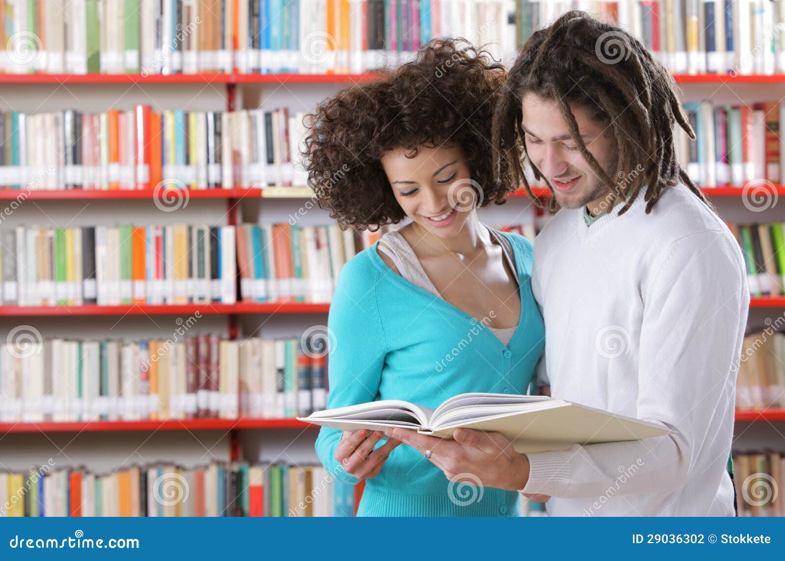 Two Students Reading a Book Stock Photo - Image of mixed, book: 29036302