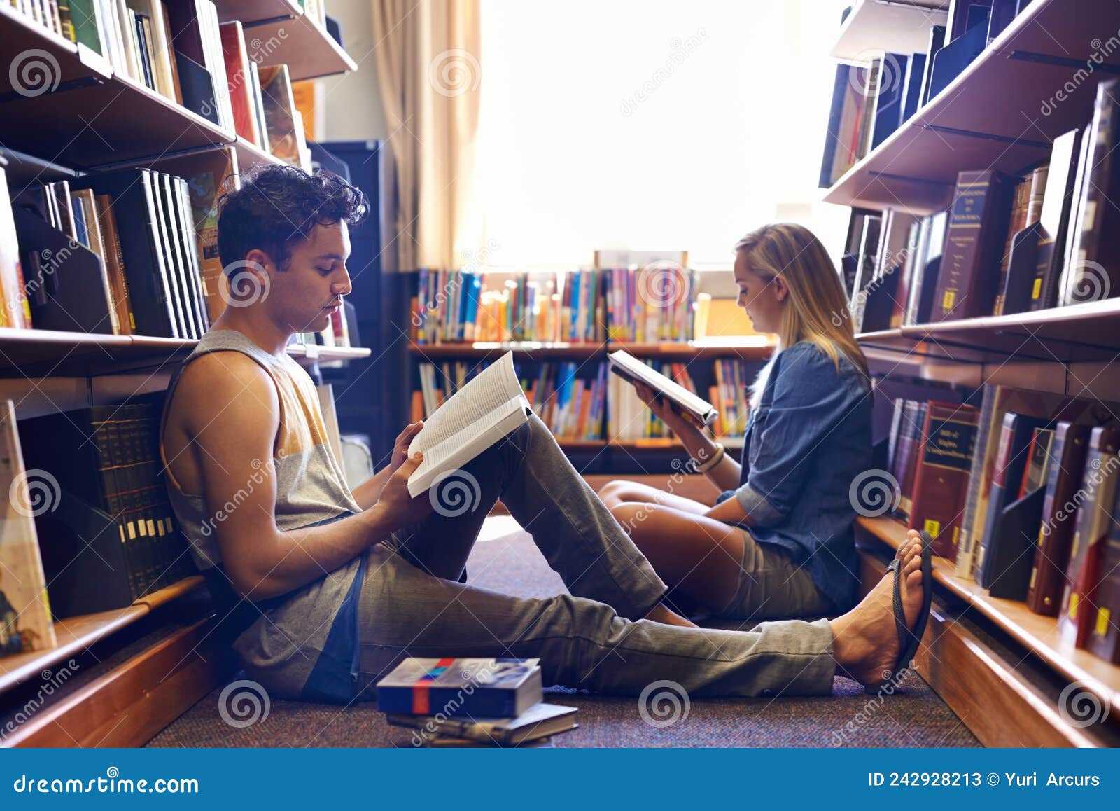 Studying Together, but Separately. Two Students Reading Separate ...