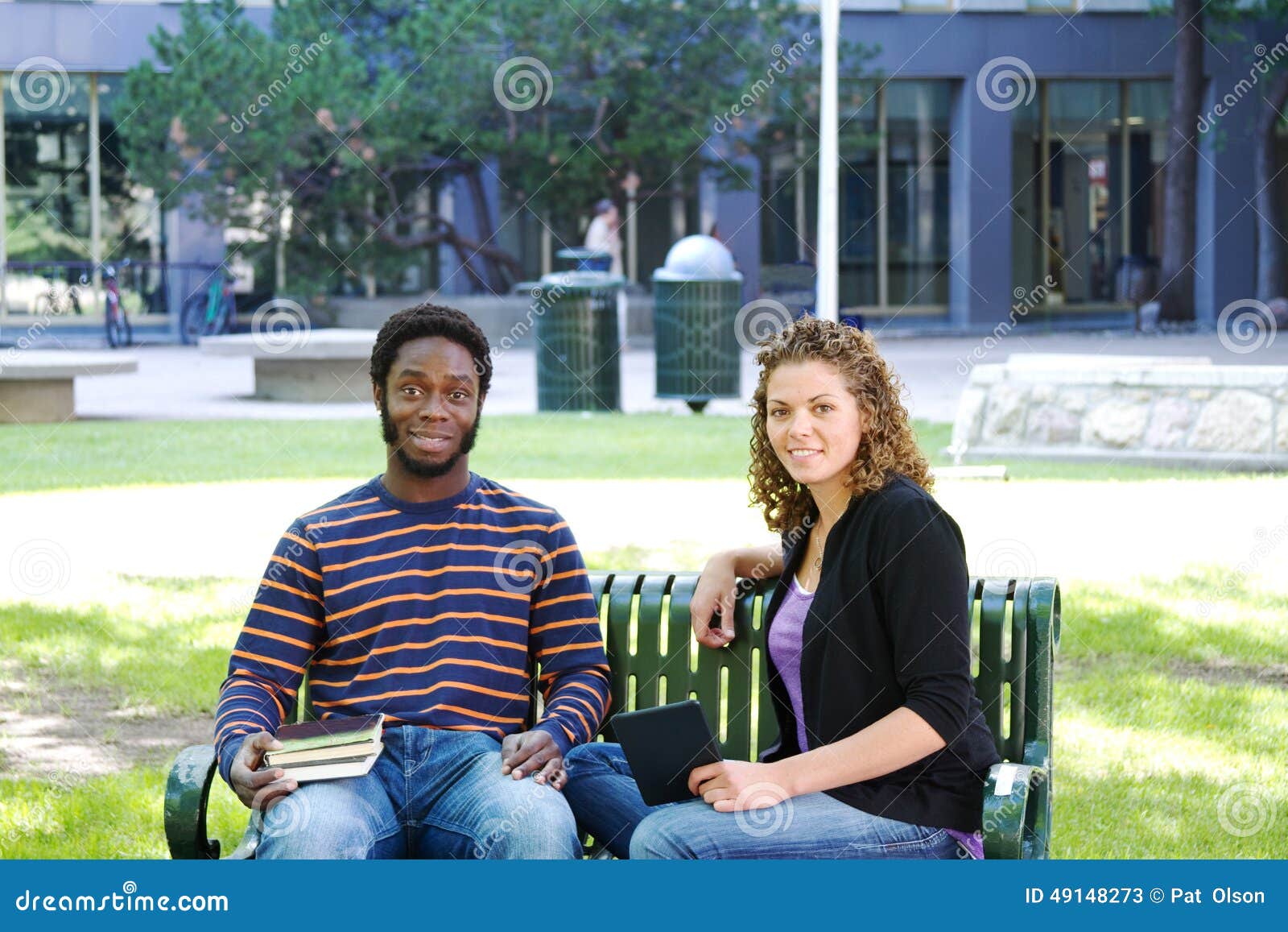 Two Students Sitting on Bench Stock Image - Image of casual, person ...