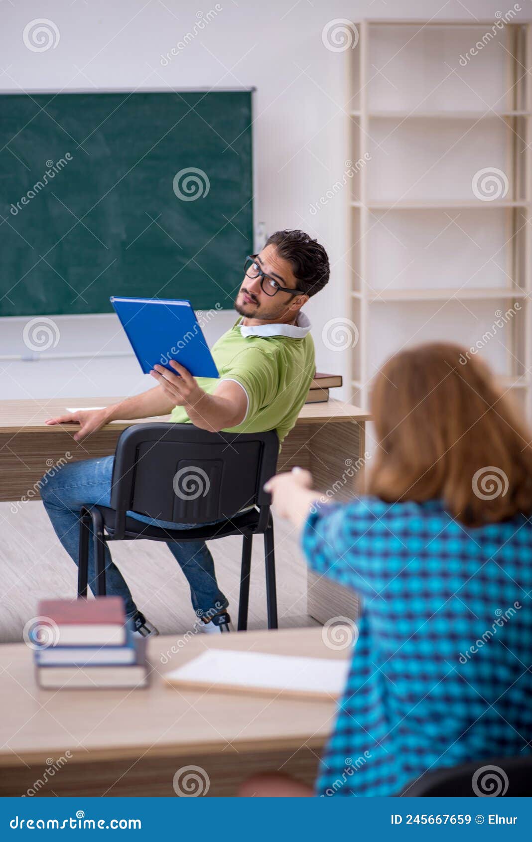 Two Students Sitting in the Classroom Stock Image - Image of chalkboard ...