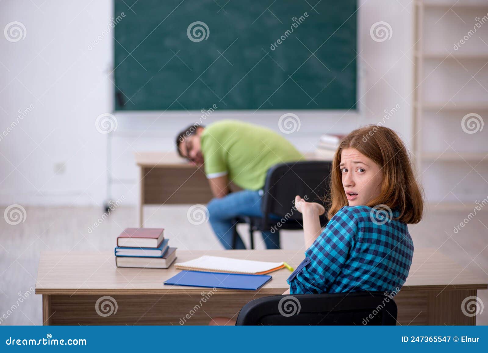Two Students Sitting in the Classroom Stock Image - Image of blackboard ...