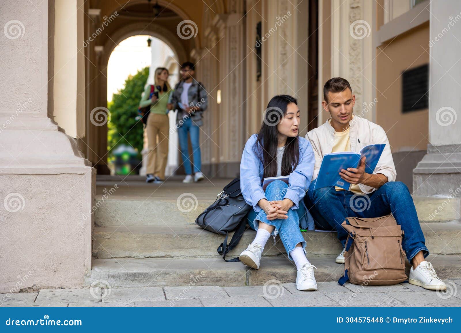 Two Students Sitting on School Stairs Reading Book Together. Stock ...