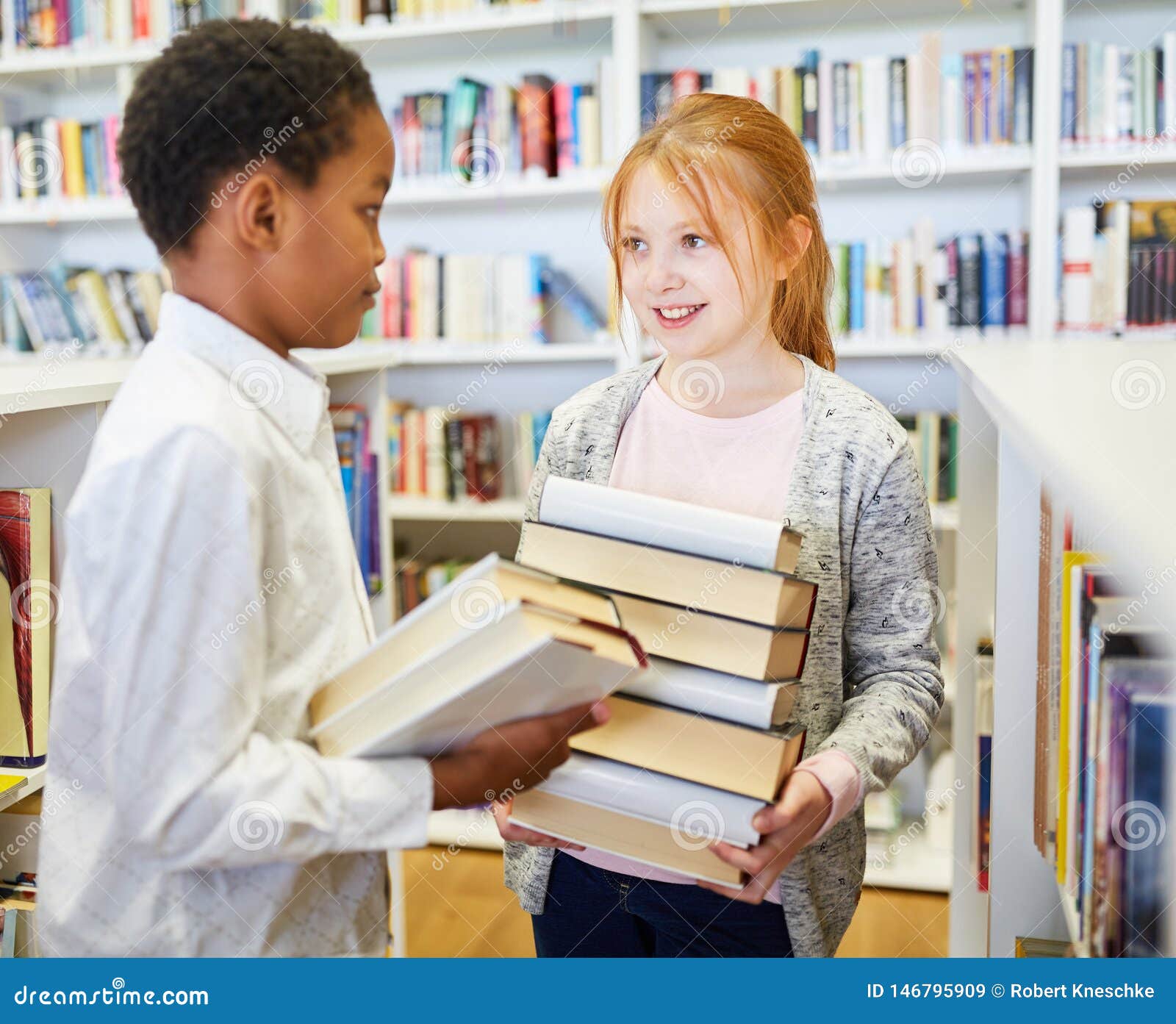 Two Students with a Stack of Books Stock Image - Image of pupil ...