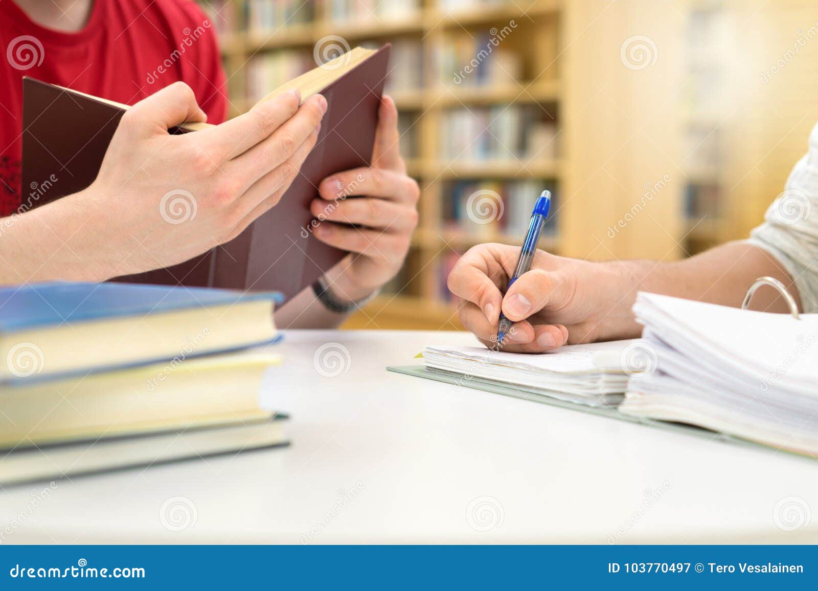 Two Students Studying, Reading and Writing in Library. Stock Image ...