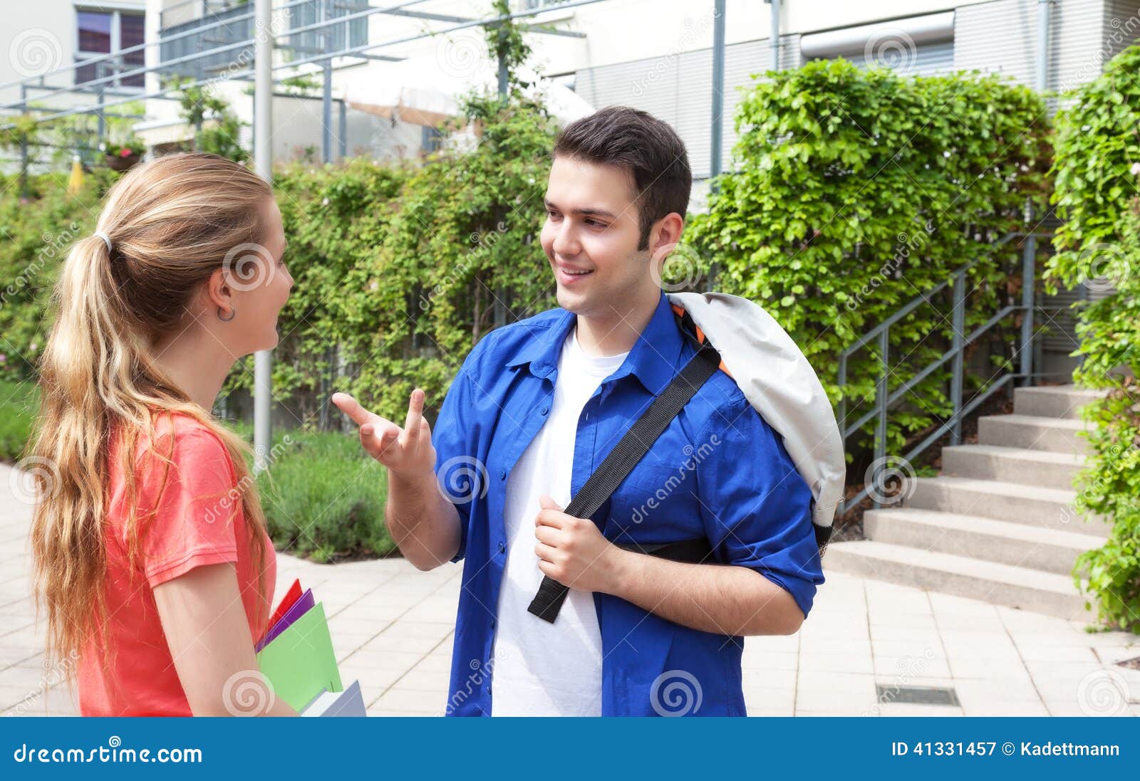 Two Students Talking on Campus Stock Image - Image of class, couple ...