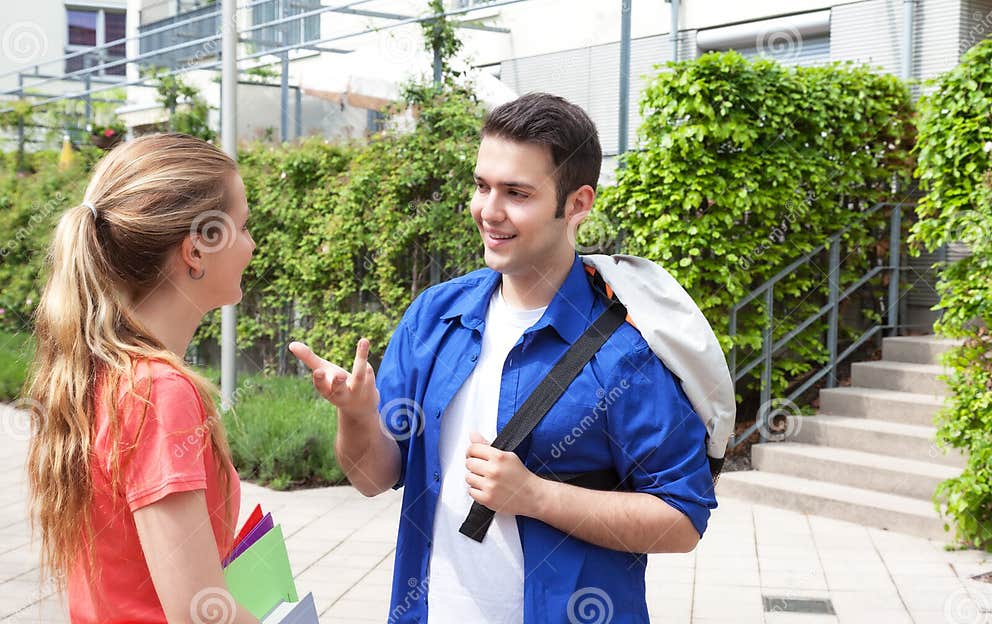 Two Students Talking on Campus Stock Image - Image of class, couple ...