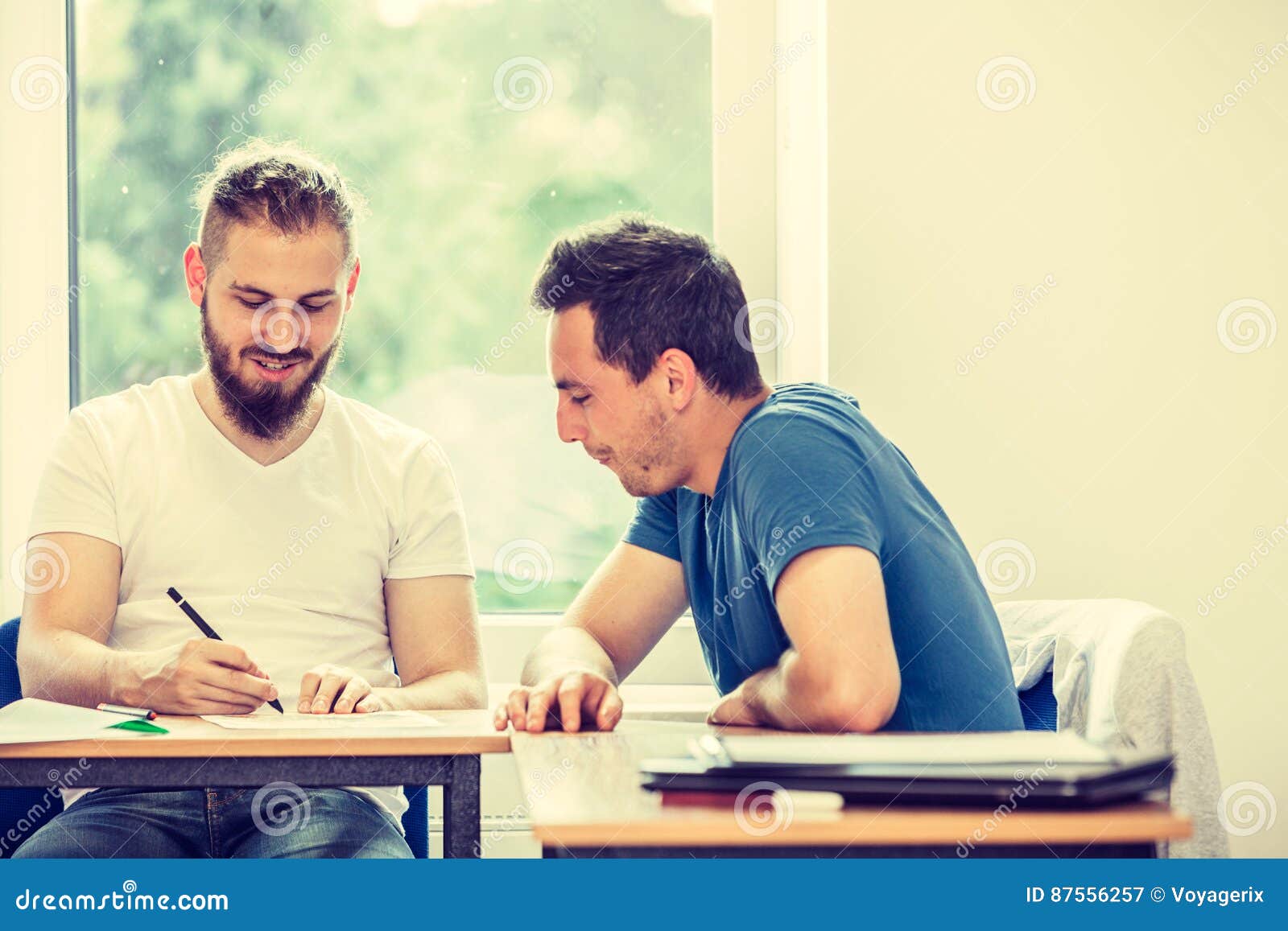 Two Students Talking In Class