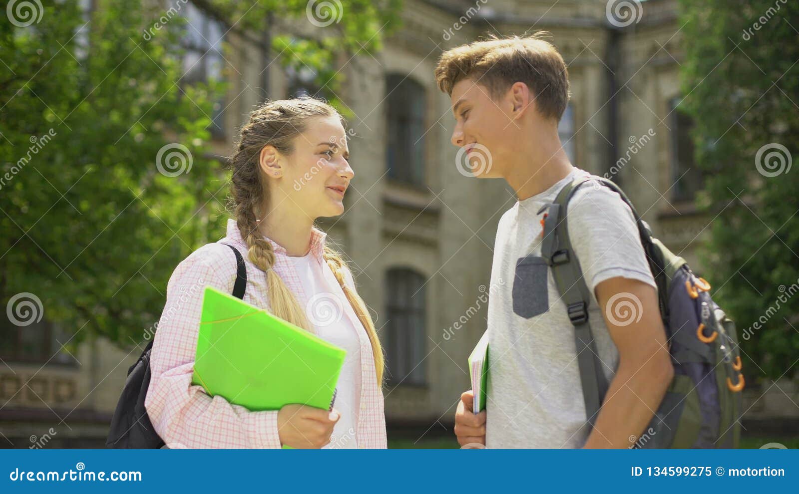 Two Students Talking and Giving High Five before Classes, University ...