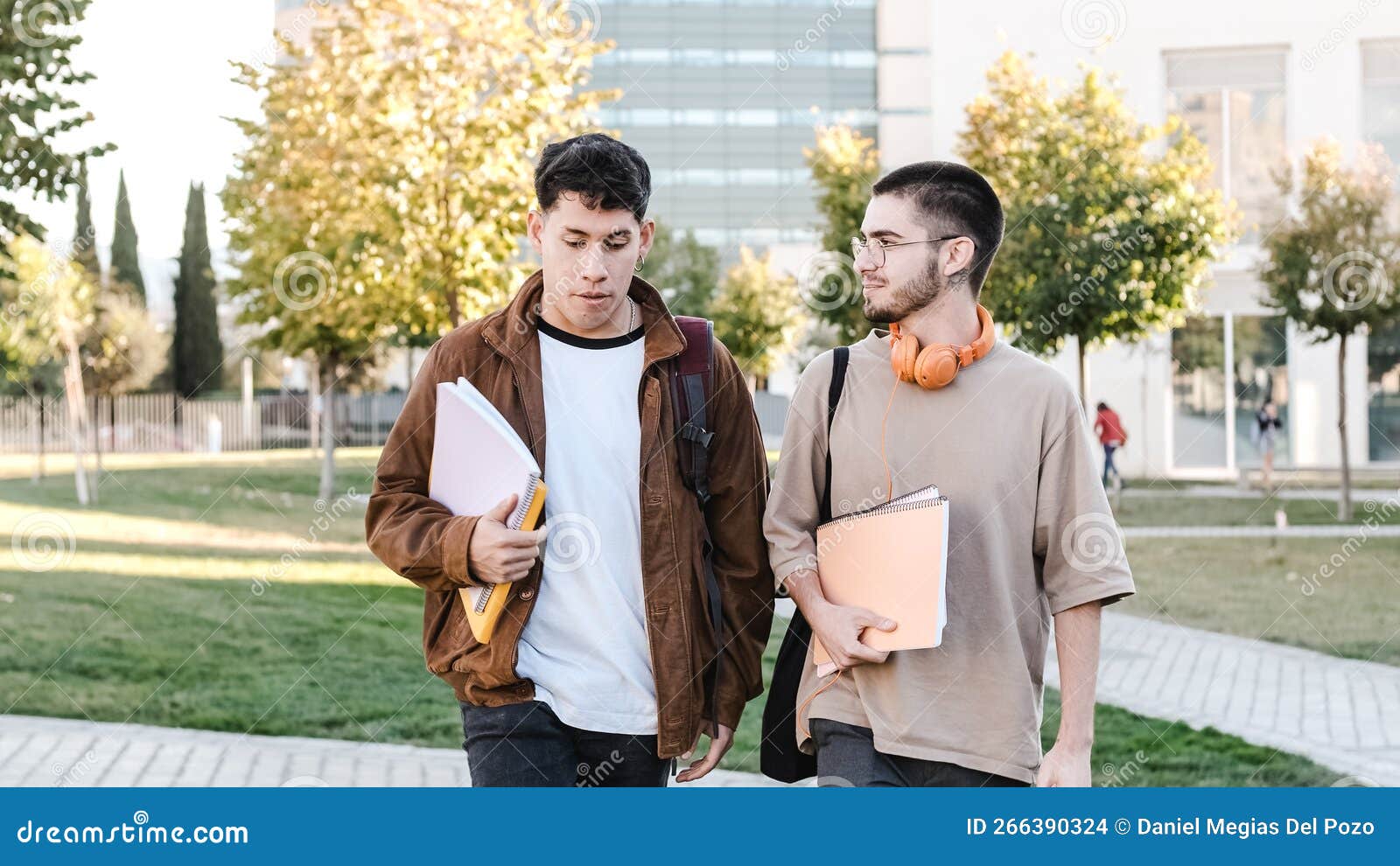 Two Students Talking while Walking in a Park Stock Photo - Image of ...