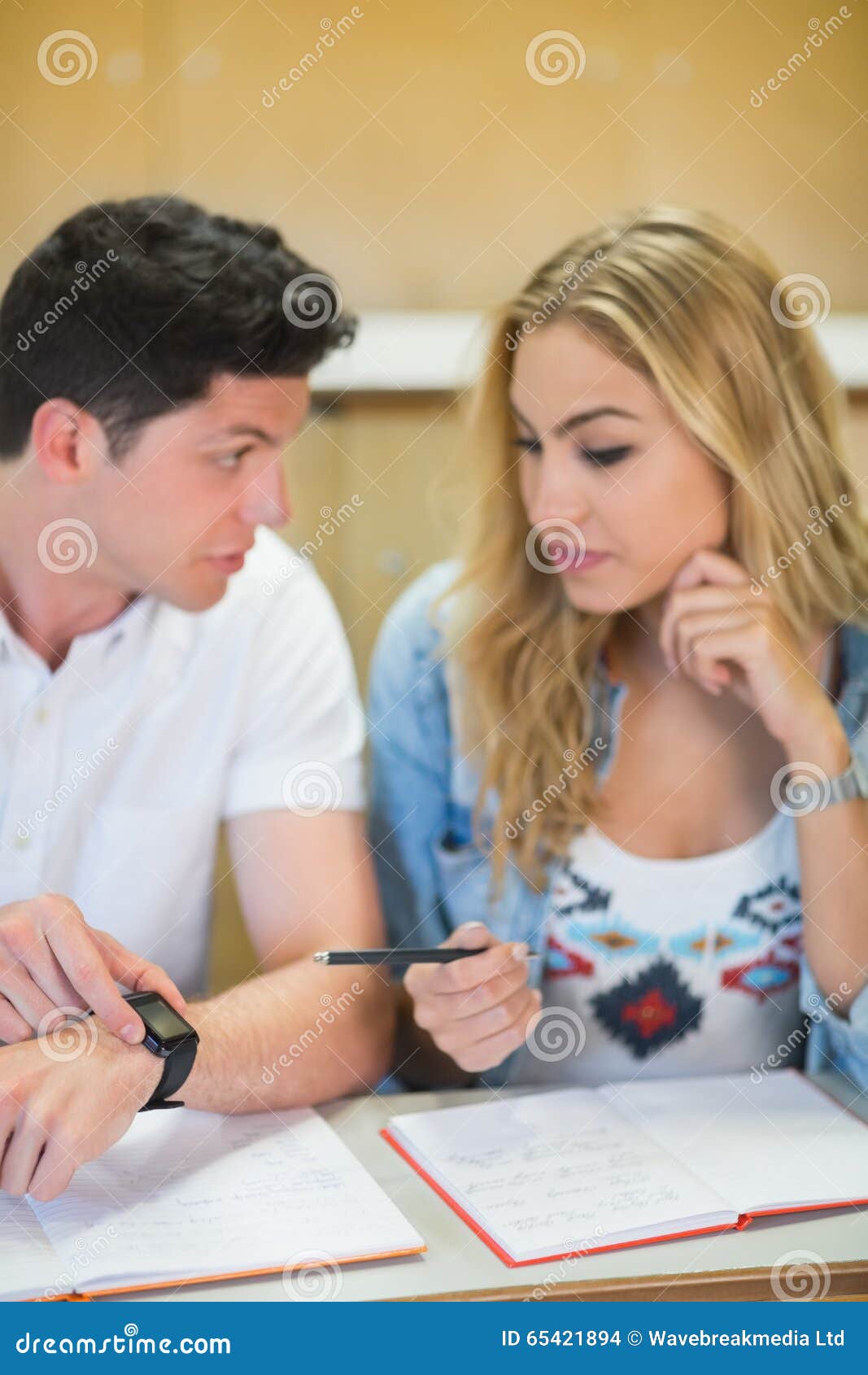 Two Students Timing Their Work Stock Photo - Image of adult, notes ...