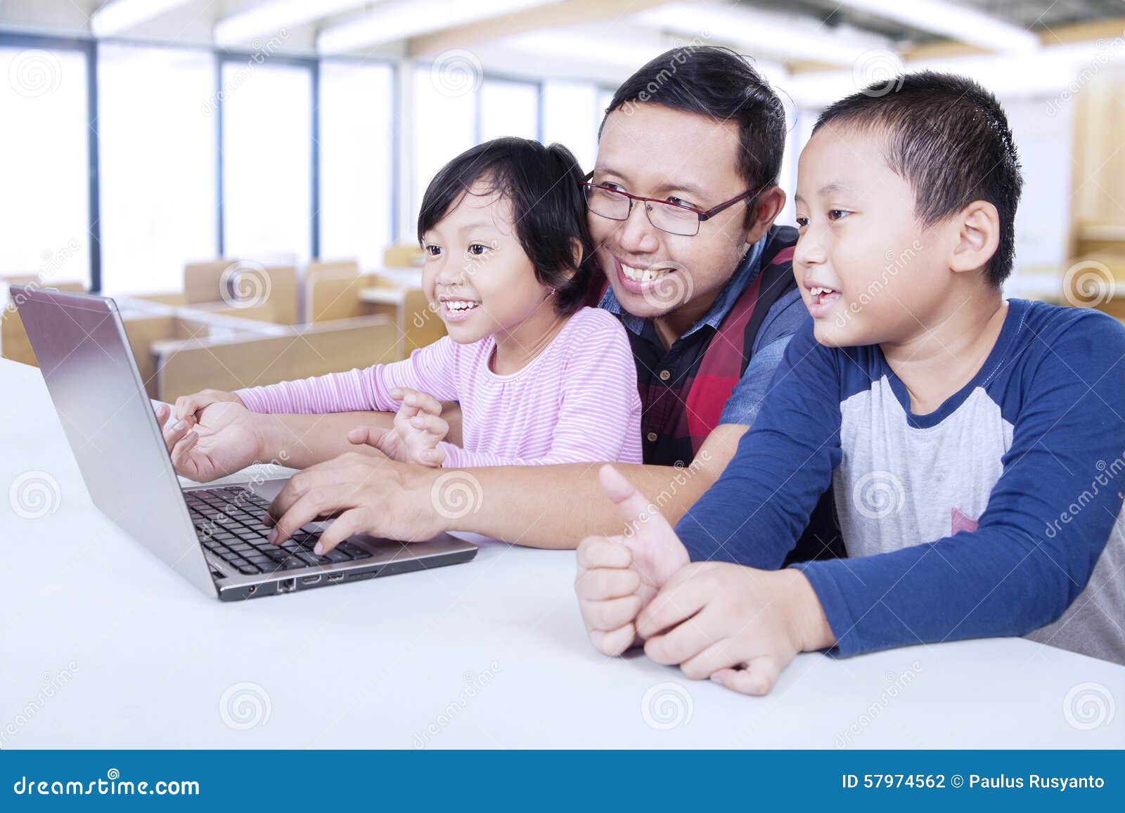 Two Students Using Laptop in Class with Teacher Stock Photo - Image of ...