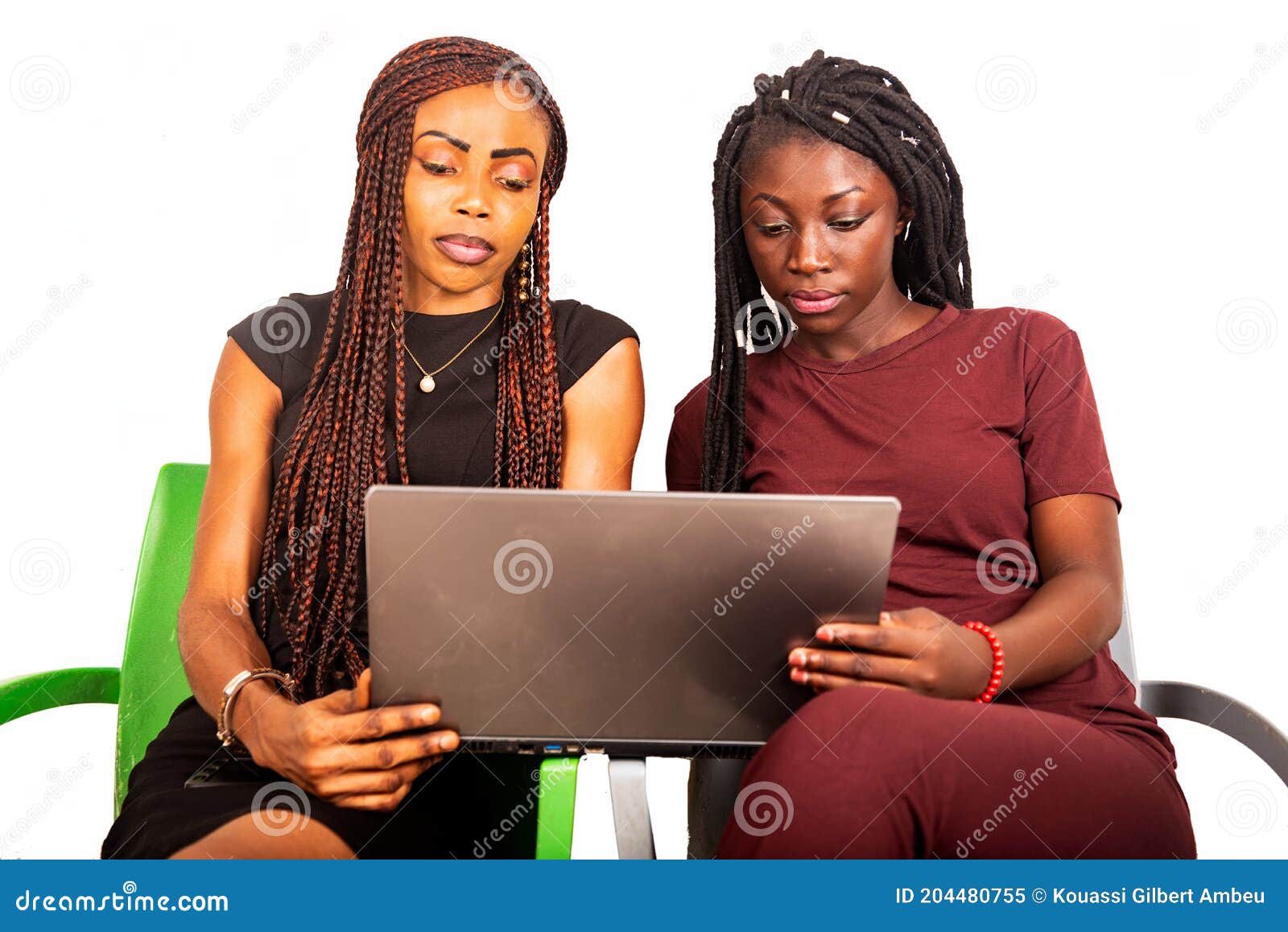 Two students using laptop stock image. Image of african - 204480755