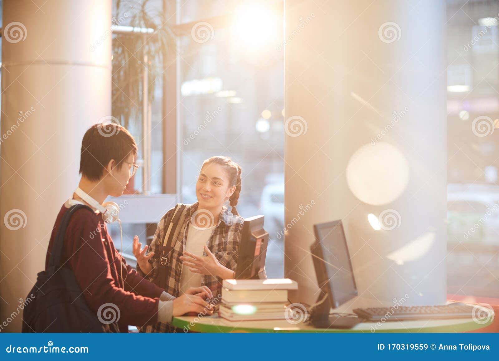 Students Standing in the Library Stock Image - Image of males, indoors ...