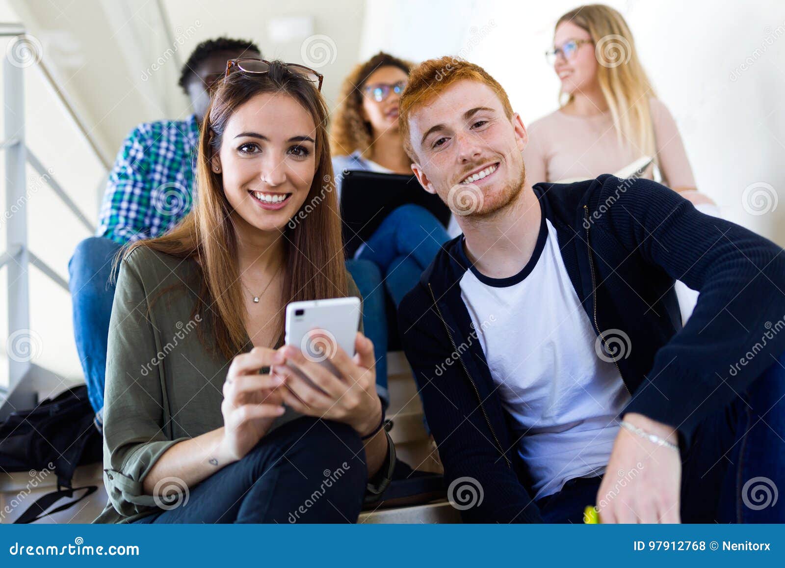 Two Students Using they Mobile Phone in a University. Stock Photo ...
