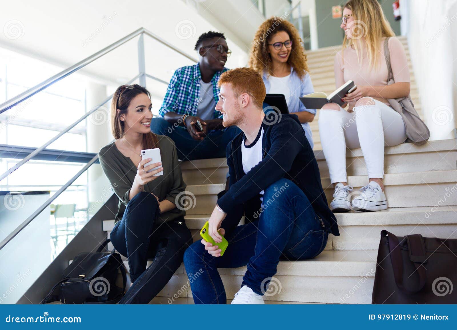 Two Students Using they Mobile Phone in a University. Stock Image ...