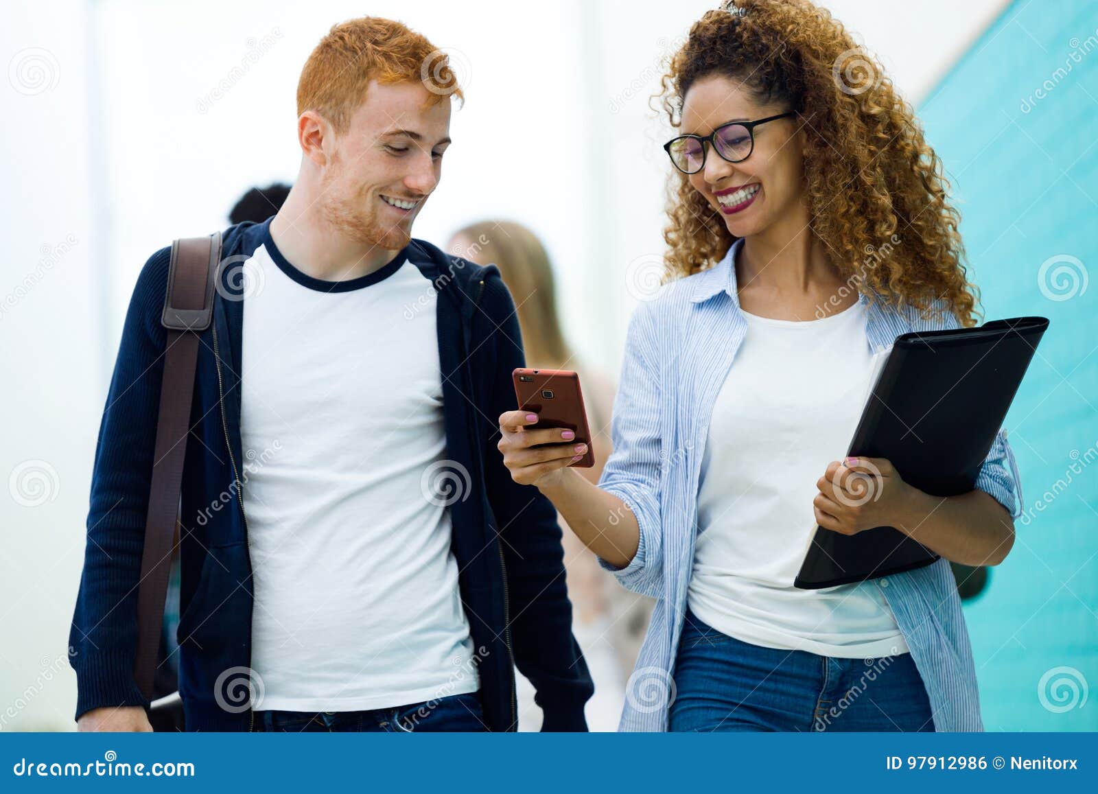 Two Students Using they Mobile Phone in a University. Stock Photo ...