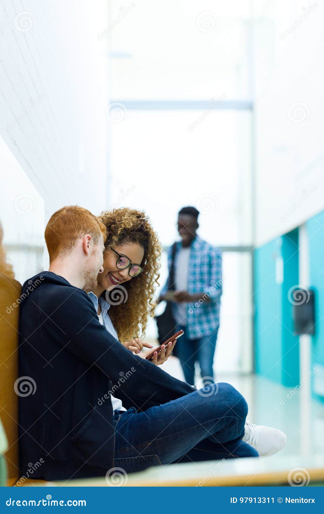 Two Students Using they Mobile Phone in a University. Stock Image ...