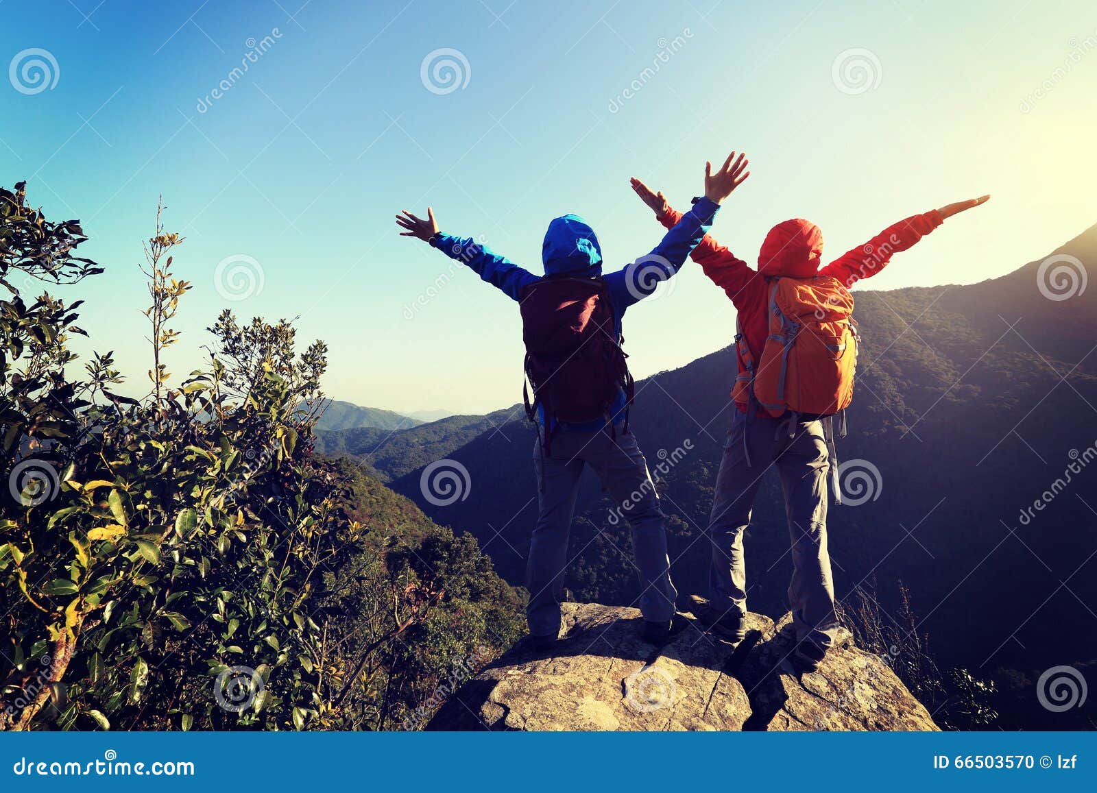 Two Successful Backpacker Open Arms at Mountain Stock Photo - Image of ...