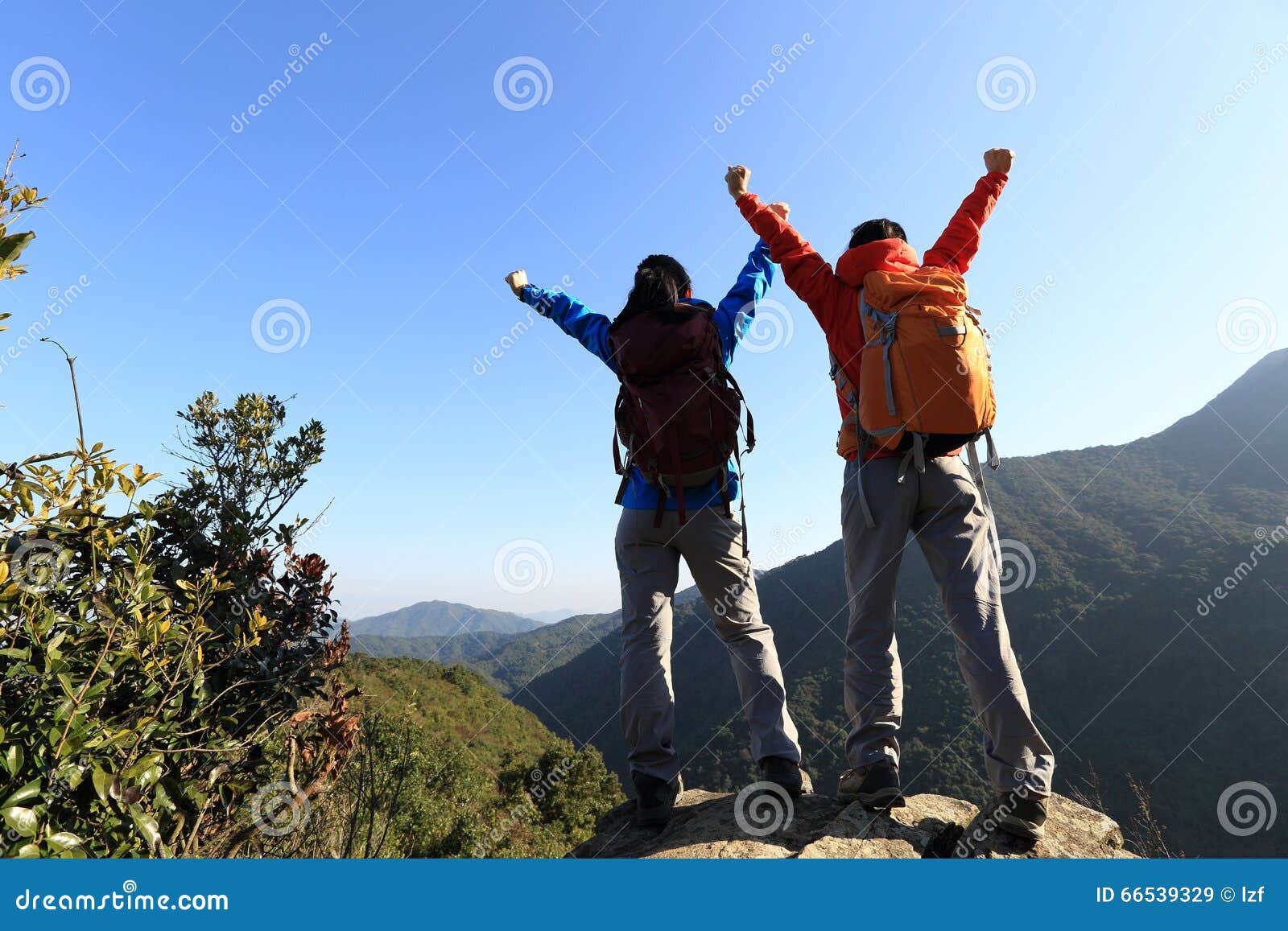 Two Successful Backpacker Open Arms at Mountain Stock Image - Image of ...