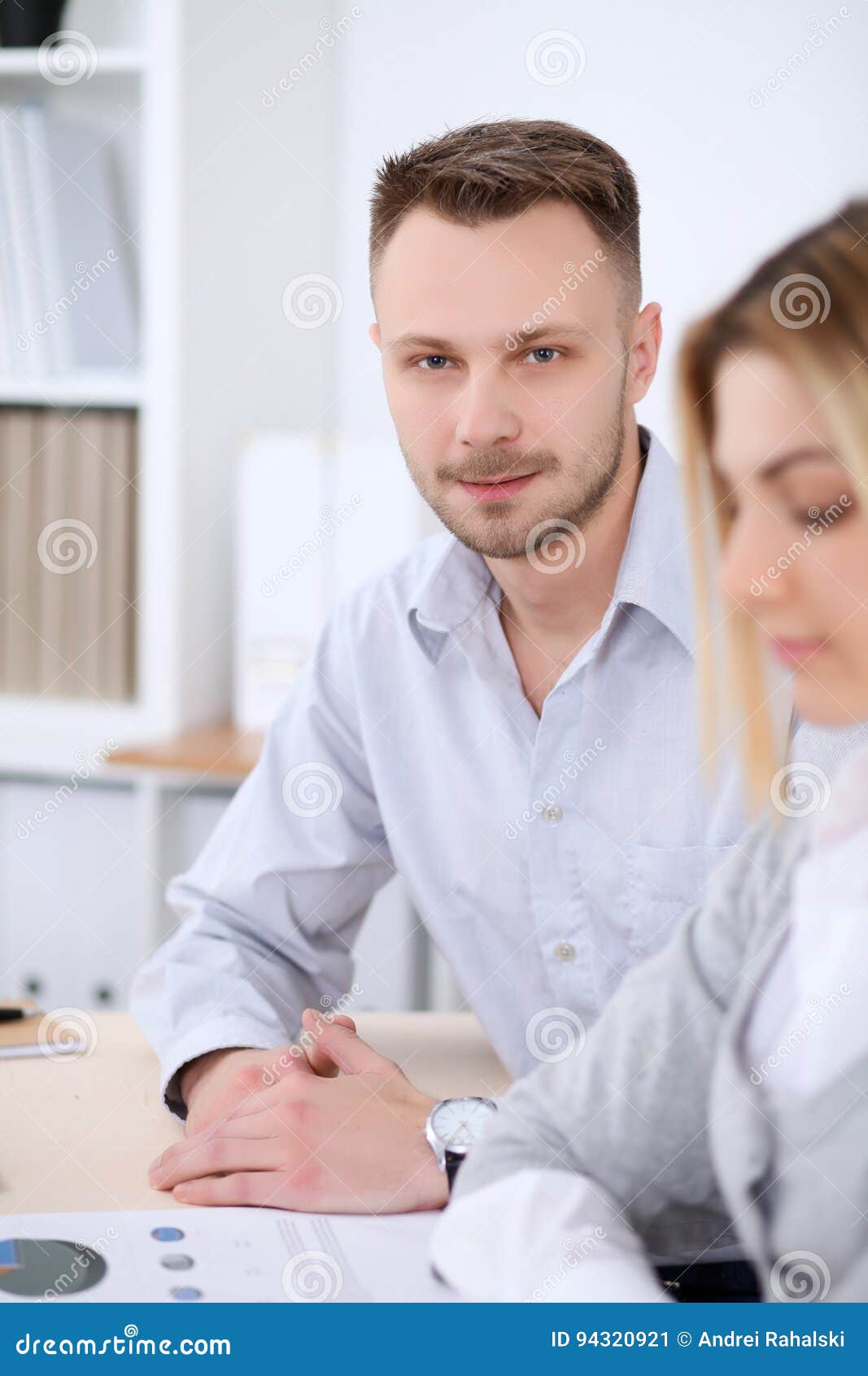 Two Successful Business Partners Working at Meeting in Office. Focus on ...