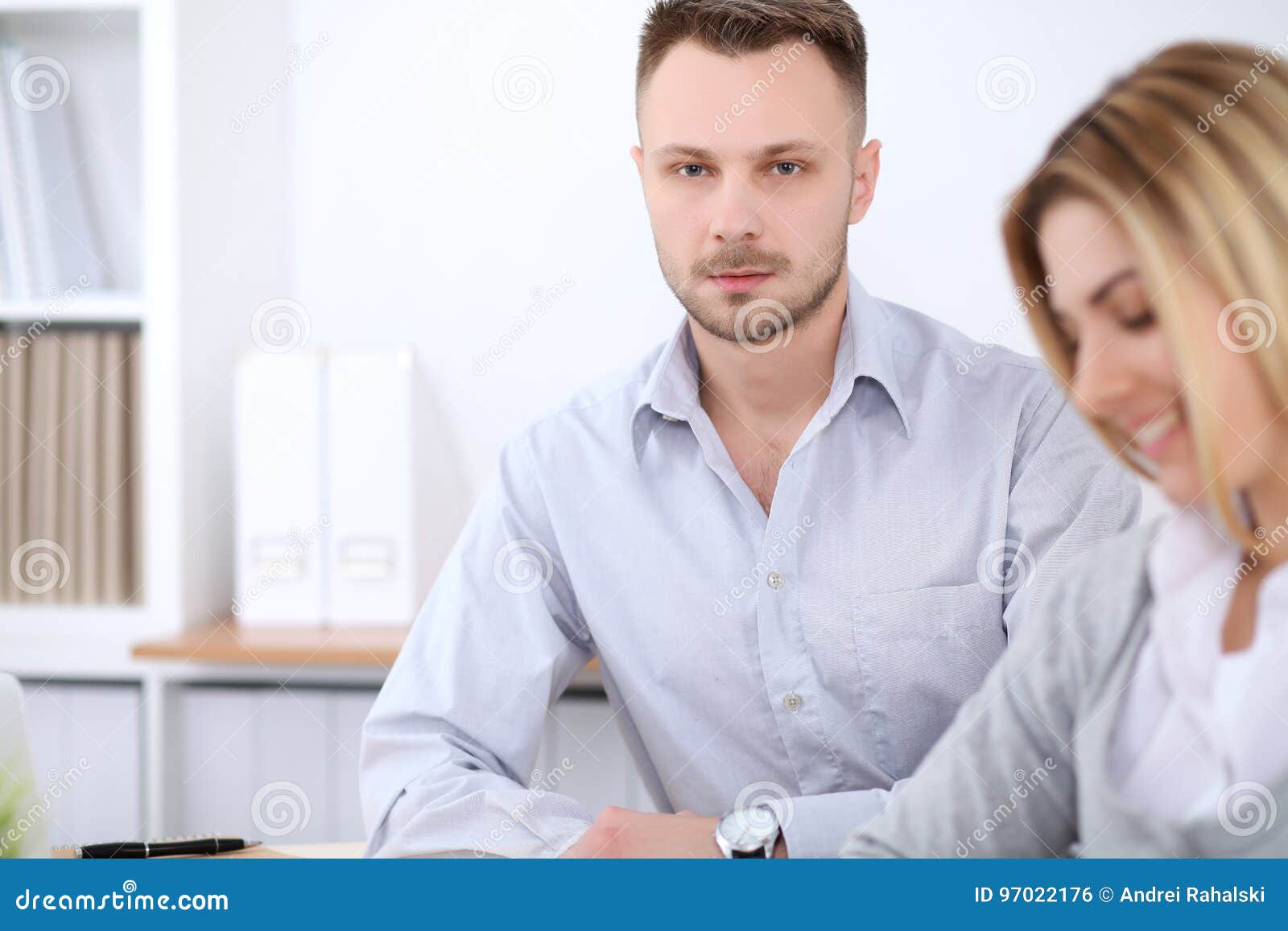 Two Successful Business Partners Working at Meeting in Office. Focus on ...