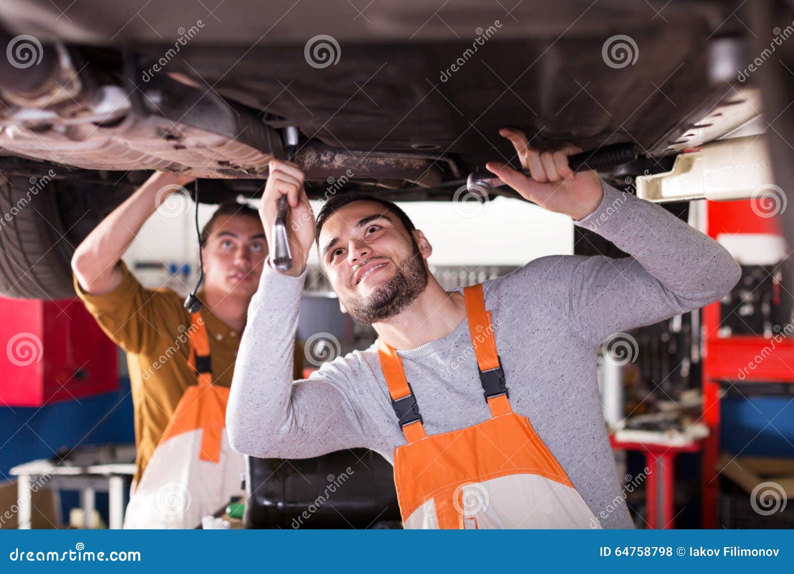 Two Successful Car Mechanics Stock Photo - Image of happiness, interior ...