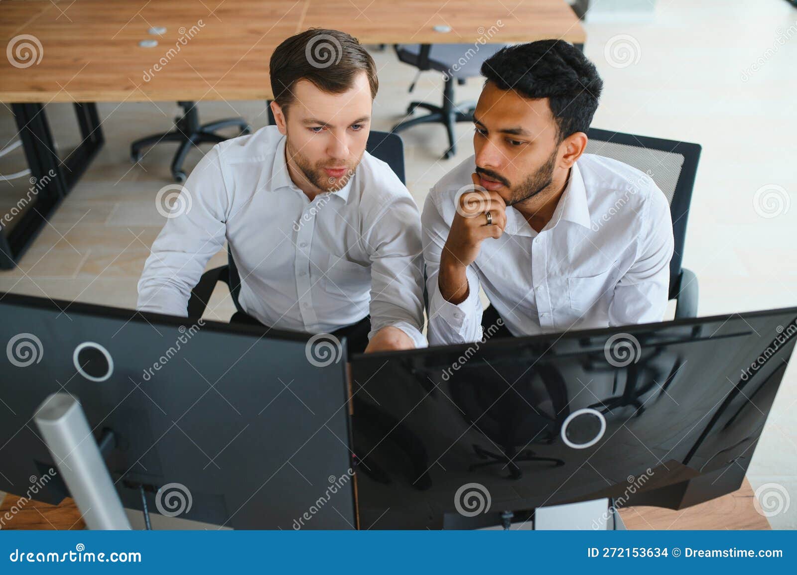 Two Successful Trader in Formalwear Pointing at Display, Analyzing Stat ...