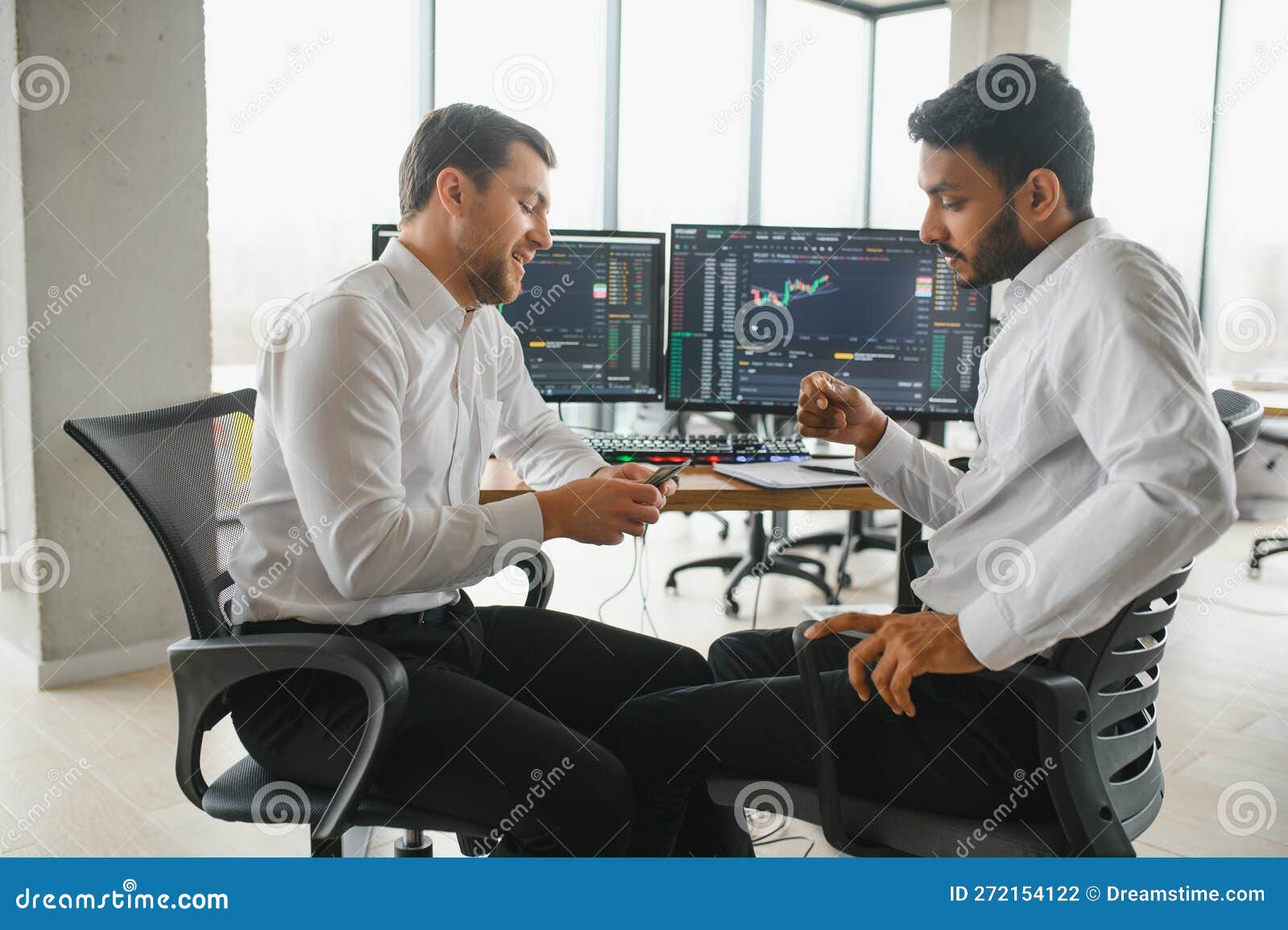 Two Successful Trader in Formalwear Pointing at Display, Analyzing Stat ...