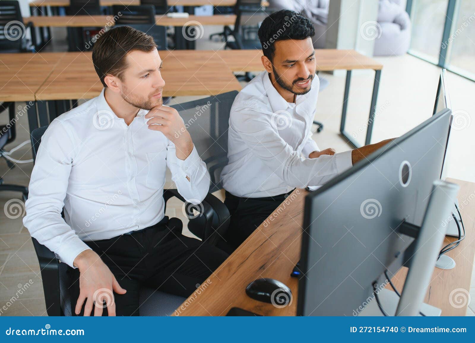 Two Successful Trader in Formalwear Pointing at Display, Analyzing Stat ...