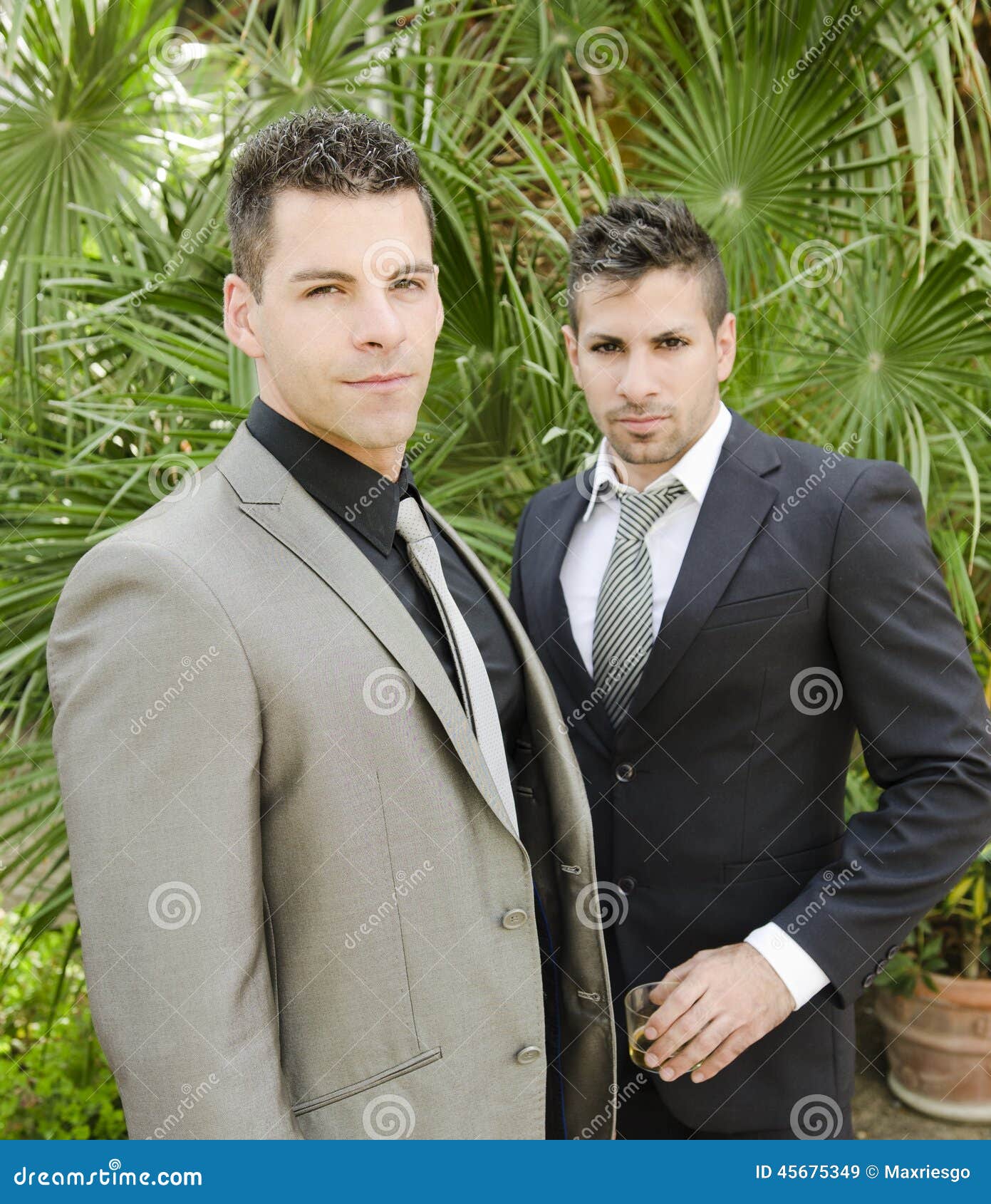 Two Suit Young Men Posing Looking at the View Stock Image - Image of ...