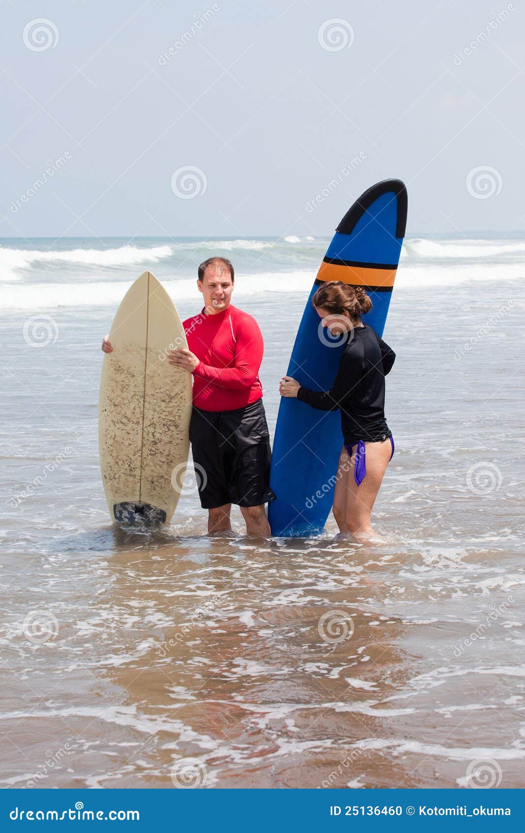 Two Surfers on an Ocean Coast Stock Photo - Image of blue, haired: 25136460
