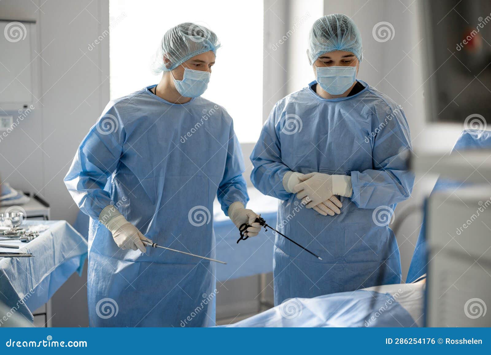 Two Surgeons Operating a Patient with Endoscopes Stock Photo - Image of ...