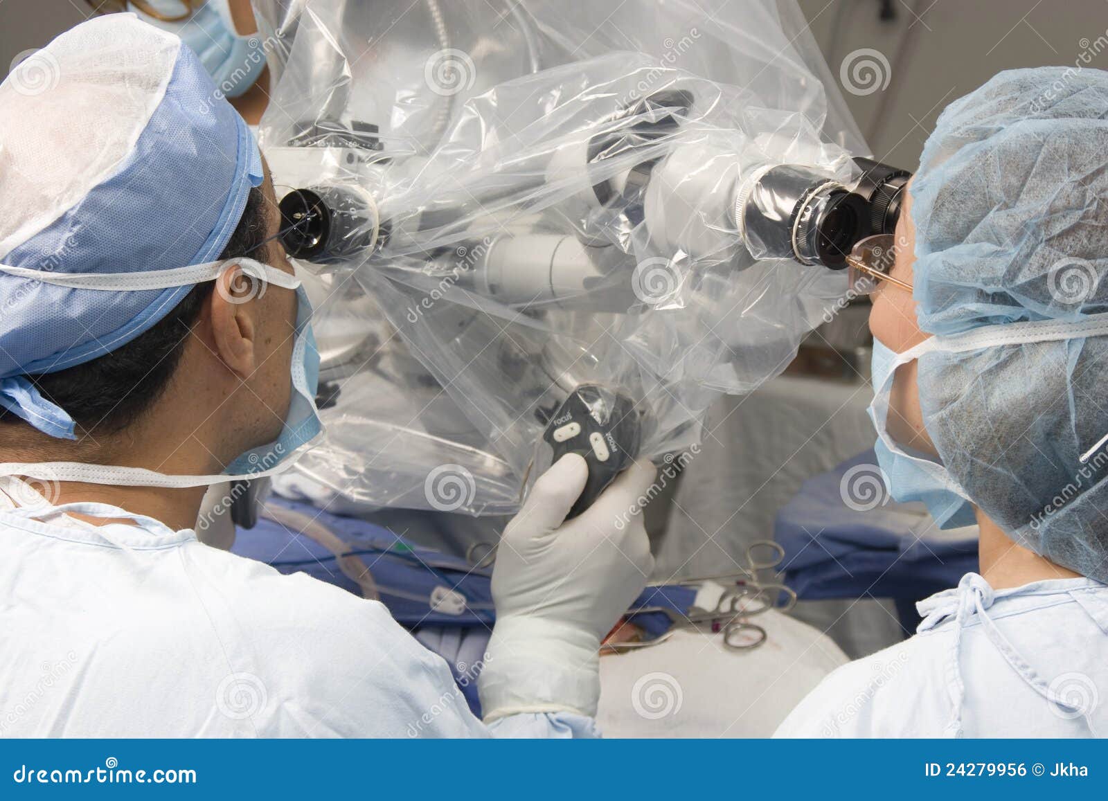 Surgeons Using Surgical Instruments For Keyhole Surgery, Watching The ...