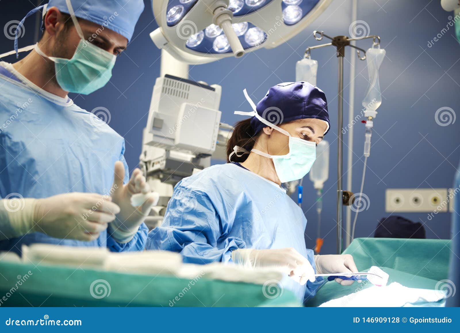 Two Surgeons Working Together in Operating Room Stock Photo - Image of ...