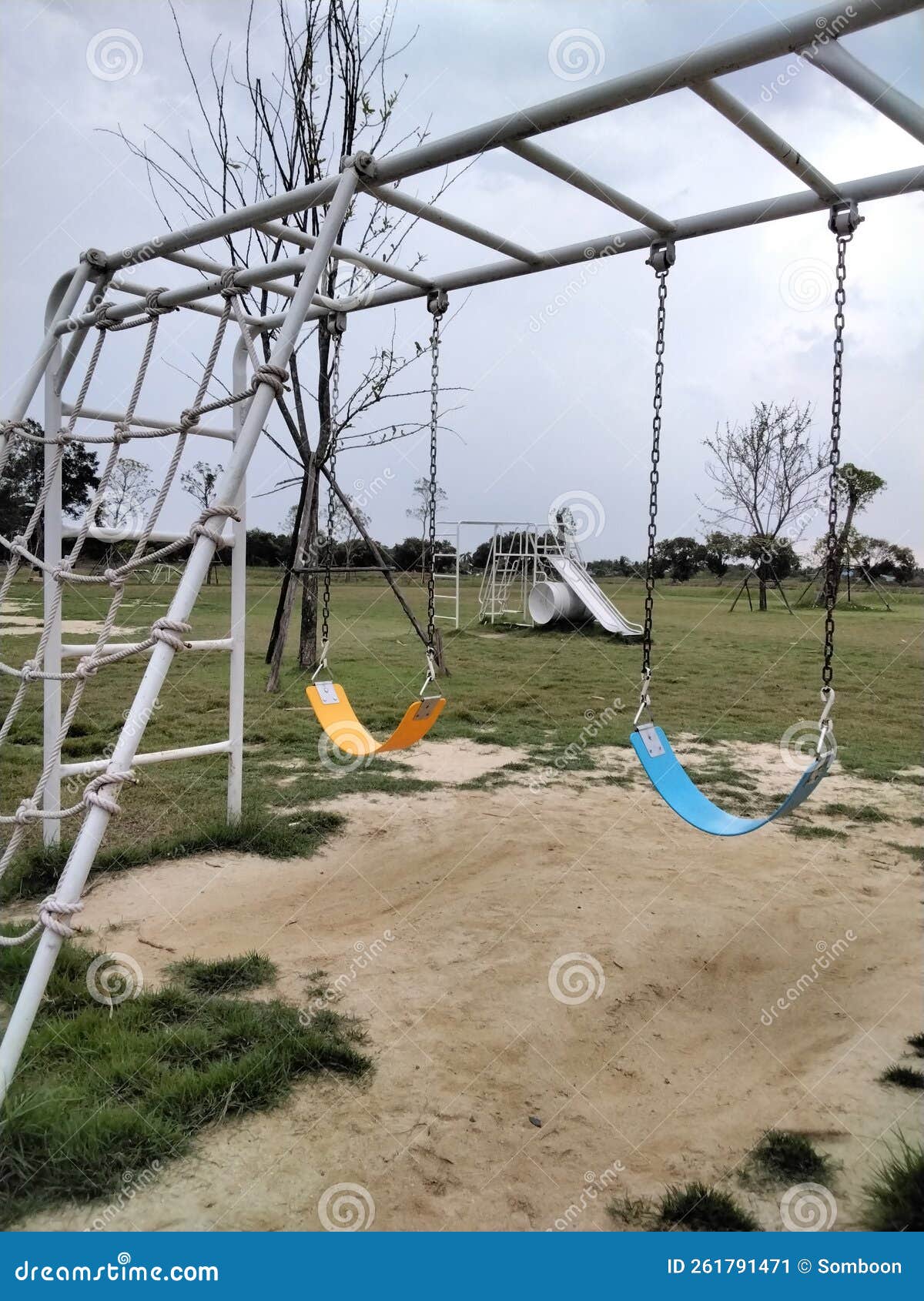 Two Swings in the Playground Stock Image - Image of fence, swings ...