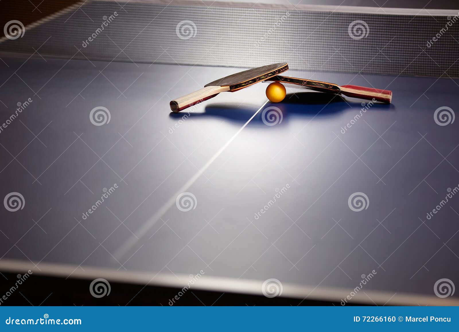 Two Table Tennis or Ping Pong Rackets and Ball on a Blue Table W Stock ...