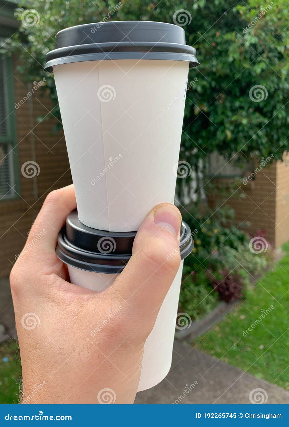 Two Take Away Coffees Held in One Hand Stock Image - Image of ...